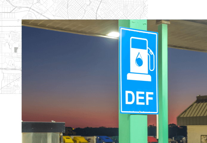 Several fuel trucks fueling up at a rack location.